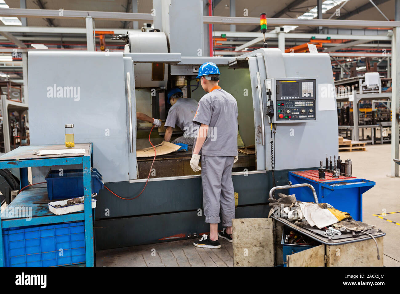 Employees working on the factory on machine. Industry, Distribution ...