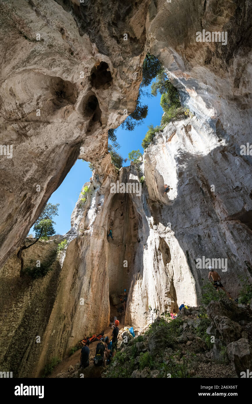 Rock climbing in a cave in Finale Ligure, Italy Stock Photo - Alamy