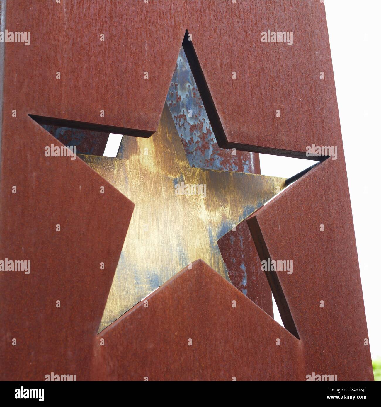 Golden European star framed by rusty negative Stock Photo - Alamy