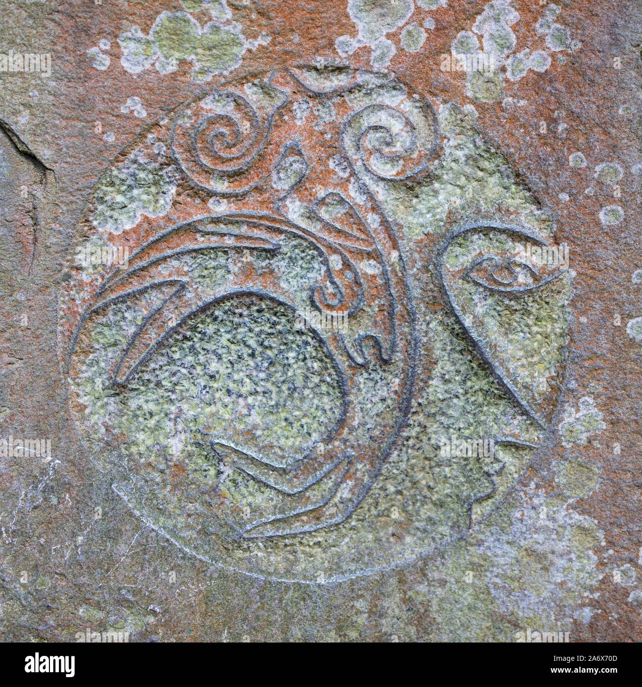 Rock with engraving Stock Photo - Alamy