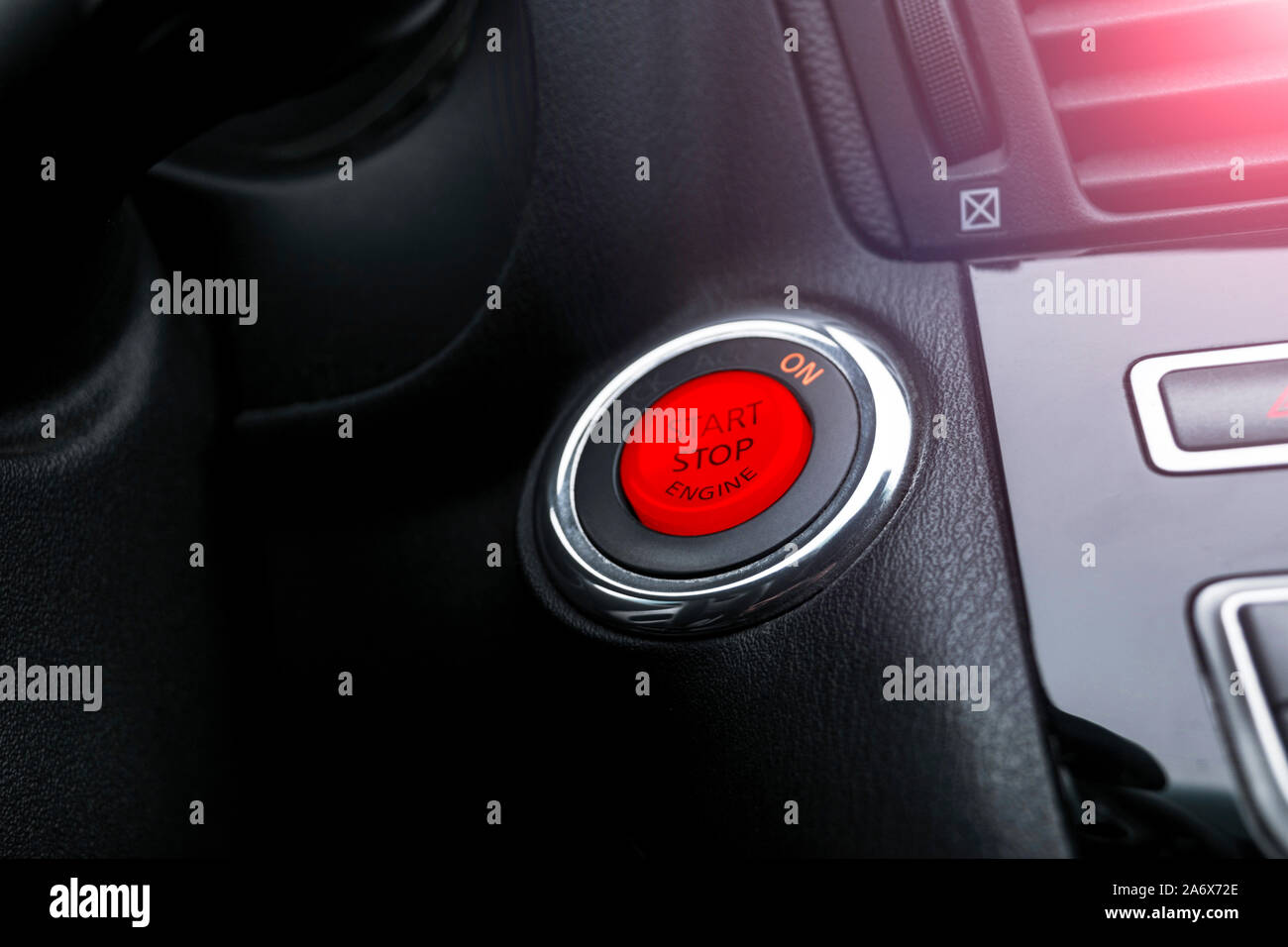 Car dashboard with focus on engine start stop button. Modern car ...