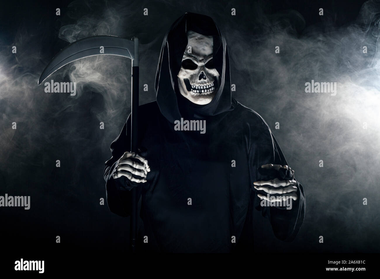 Scary looking grim reaper ghost wielding a scythe or sickle coming out ...