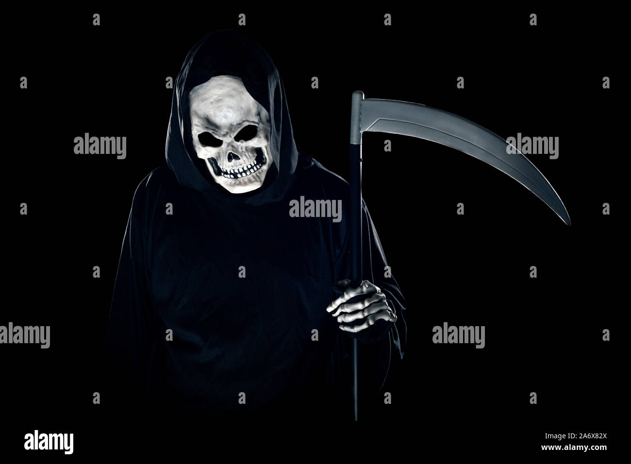 Grim Reaper ghost coming out of the shadows with a scythe or sickle ...