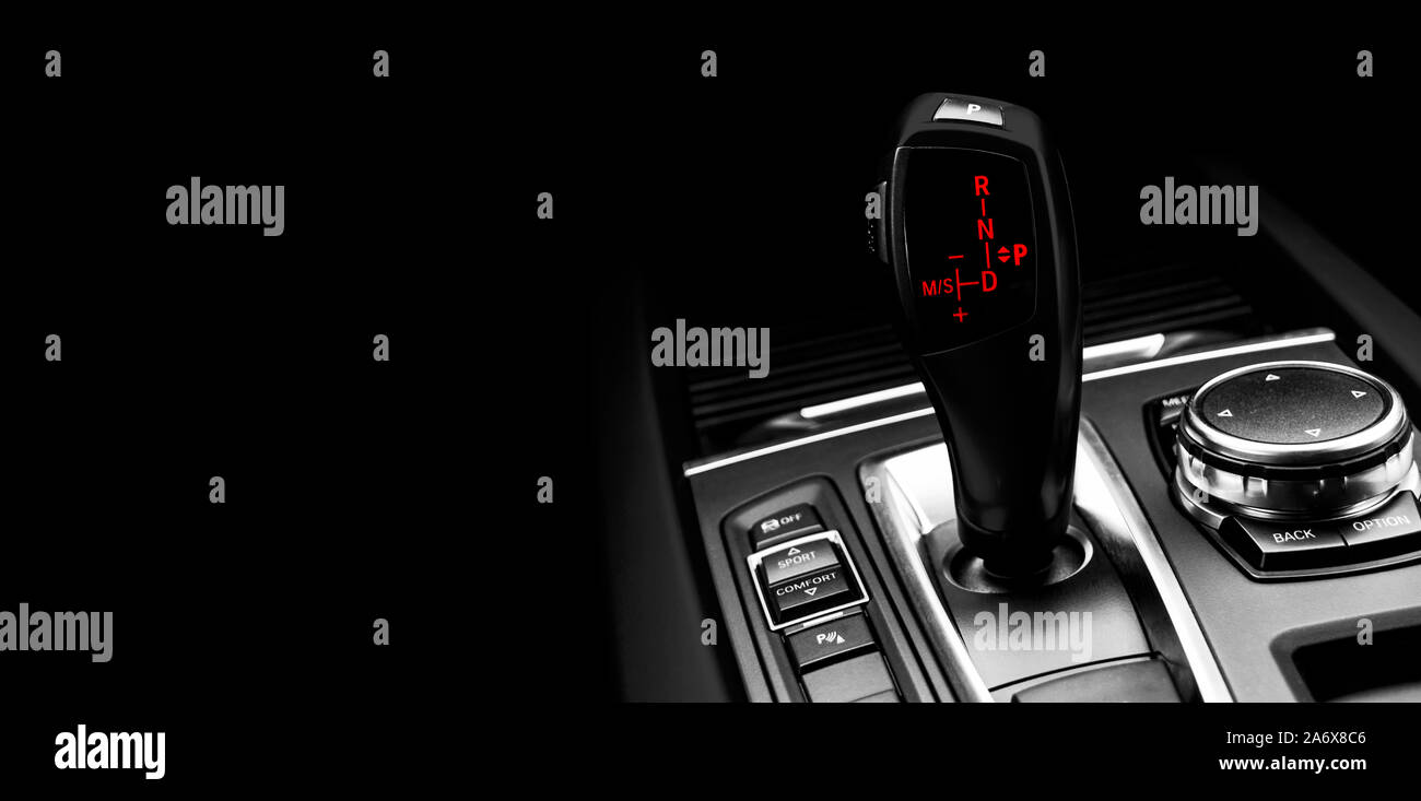 Black Automatic gear stick of a modern car. Maodern car interior details. Close up view. Car ...