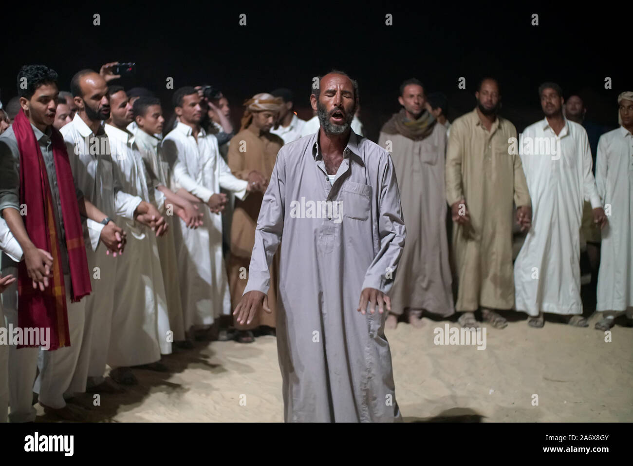 Hundreds of Siwan people form a circle (zikr) of peace and forgiveness ...