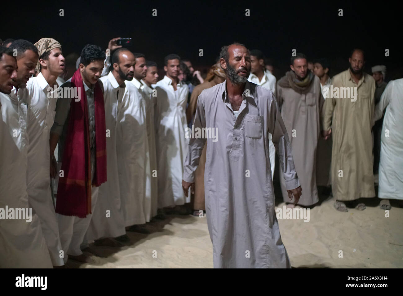 Hundreds of Siwan people form a circle (zikr) of peace and forgiveness ...