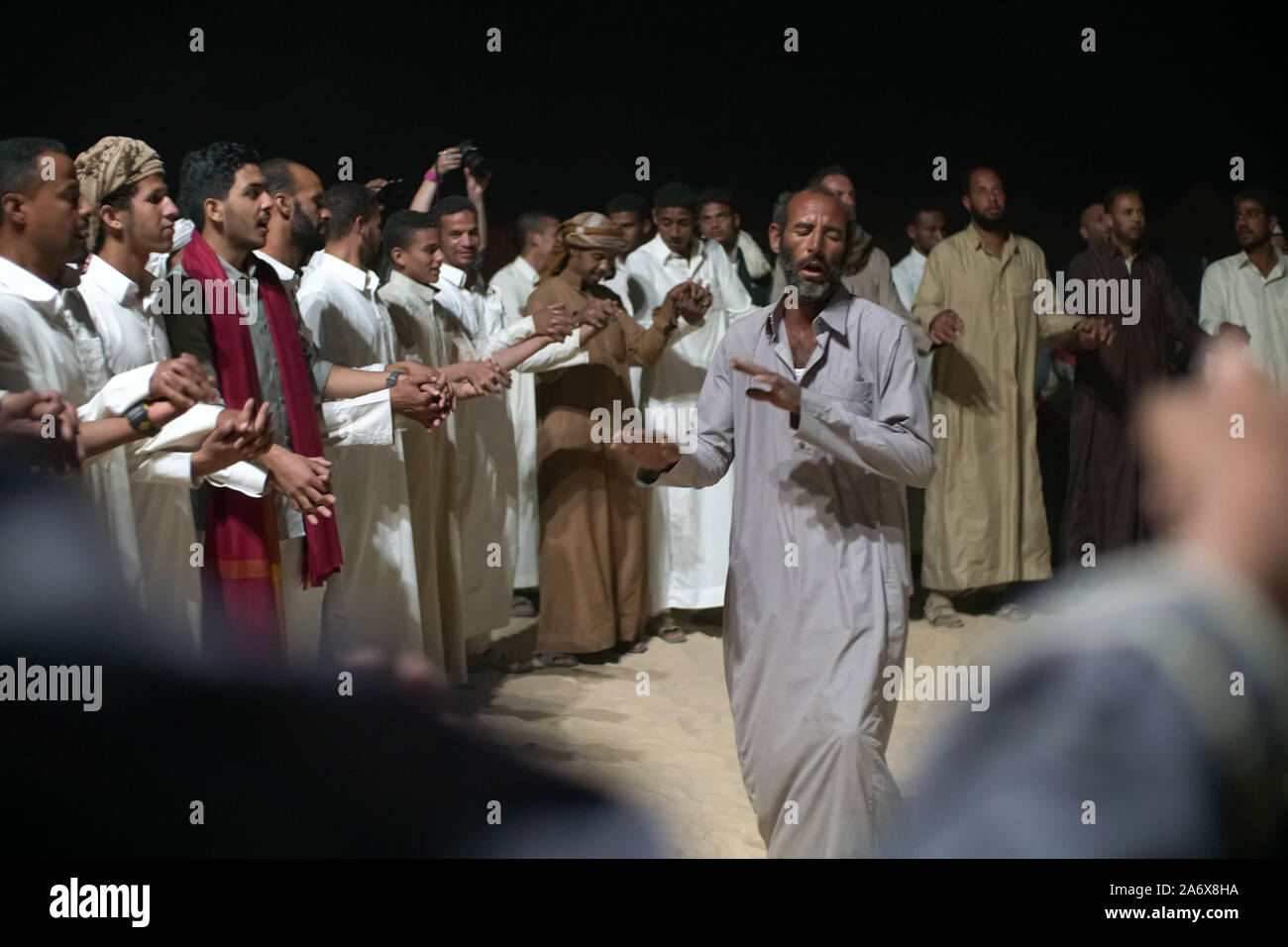 Hundreds of Siwan people form a circle (zikr) of peace and forgiveness ...