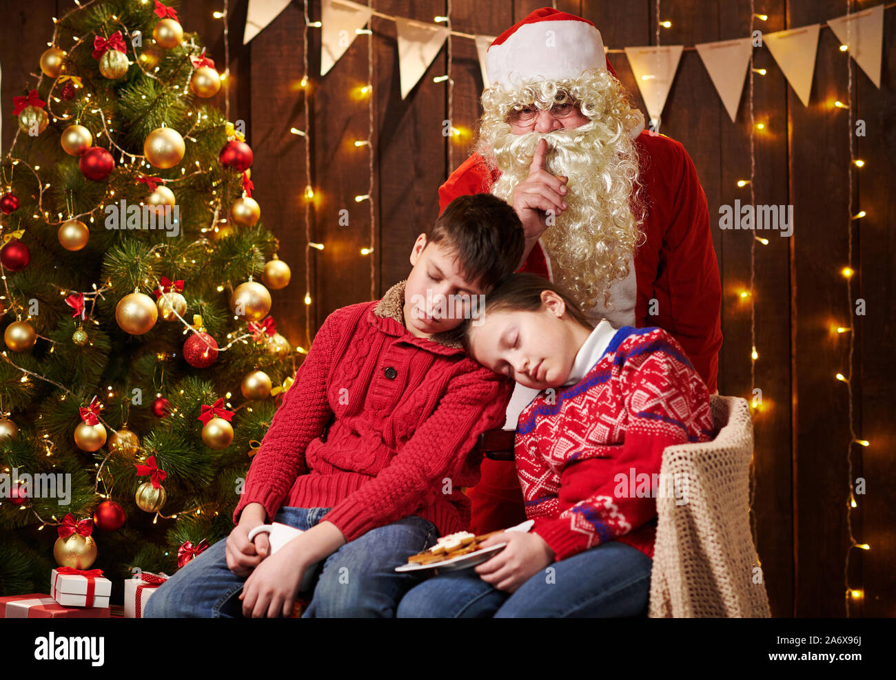 The children waited a long time for Santa, now they fell asleep and ...