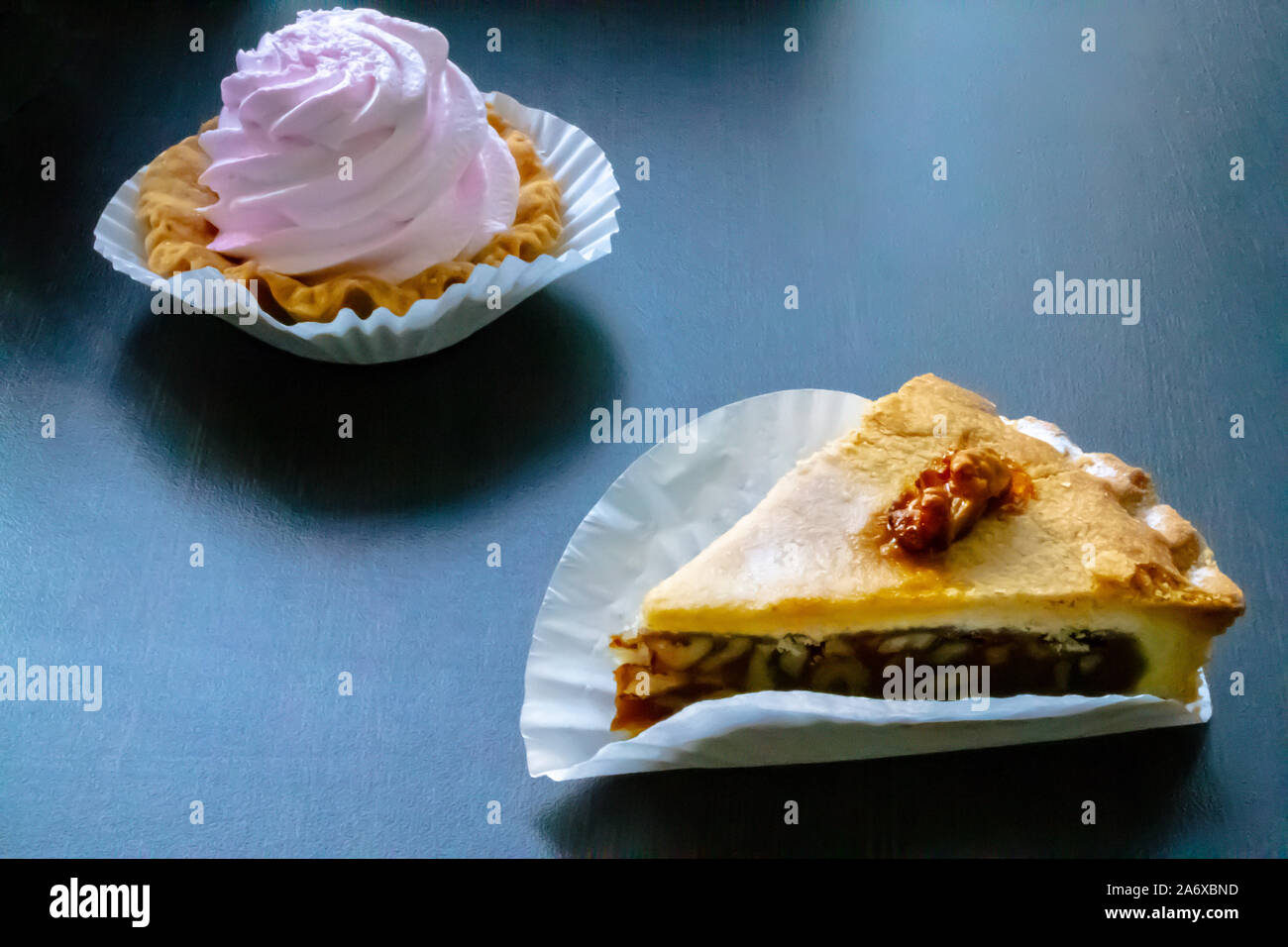 delicate dessert, a basket of light cream of light pink meringue and a ...