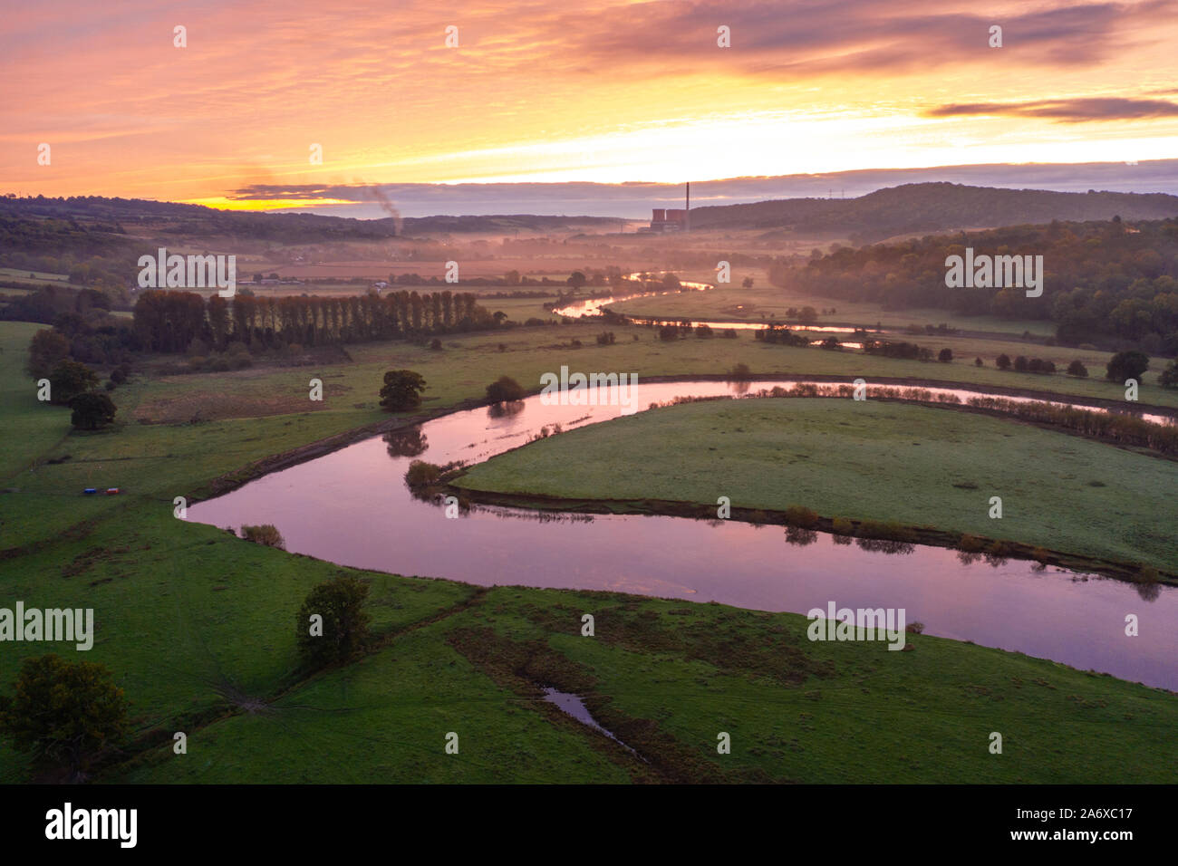 Aerial shoot over River Severn meander at hazy autumnal sunrise in ...