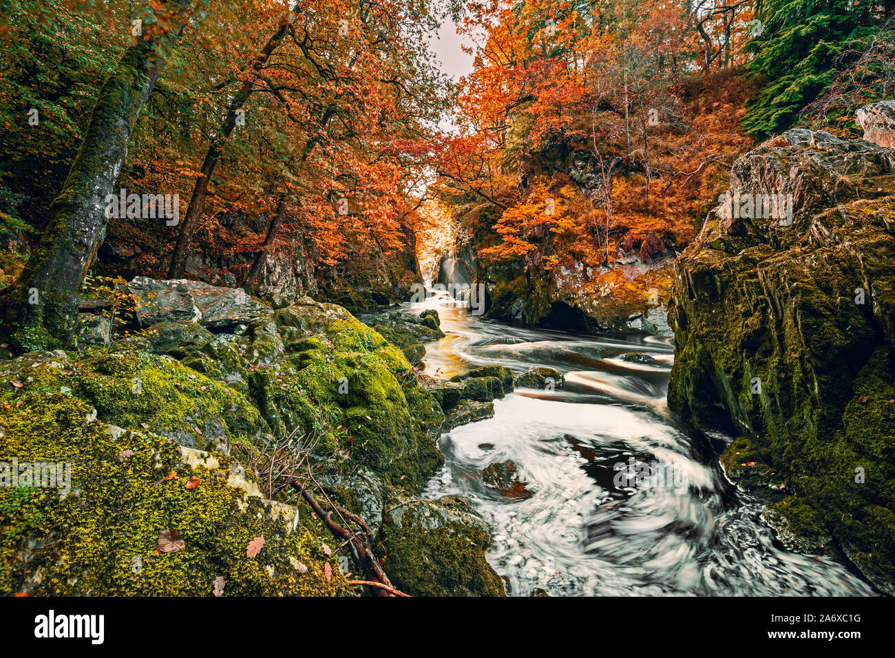Water stream between rocky gorge at autumn. Snowdonia in North Wales ...