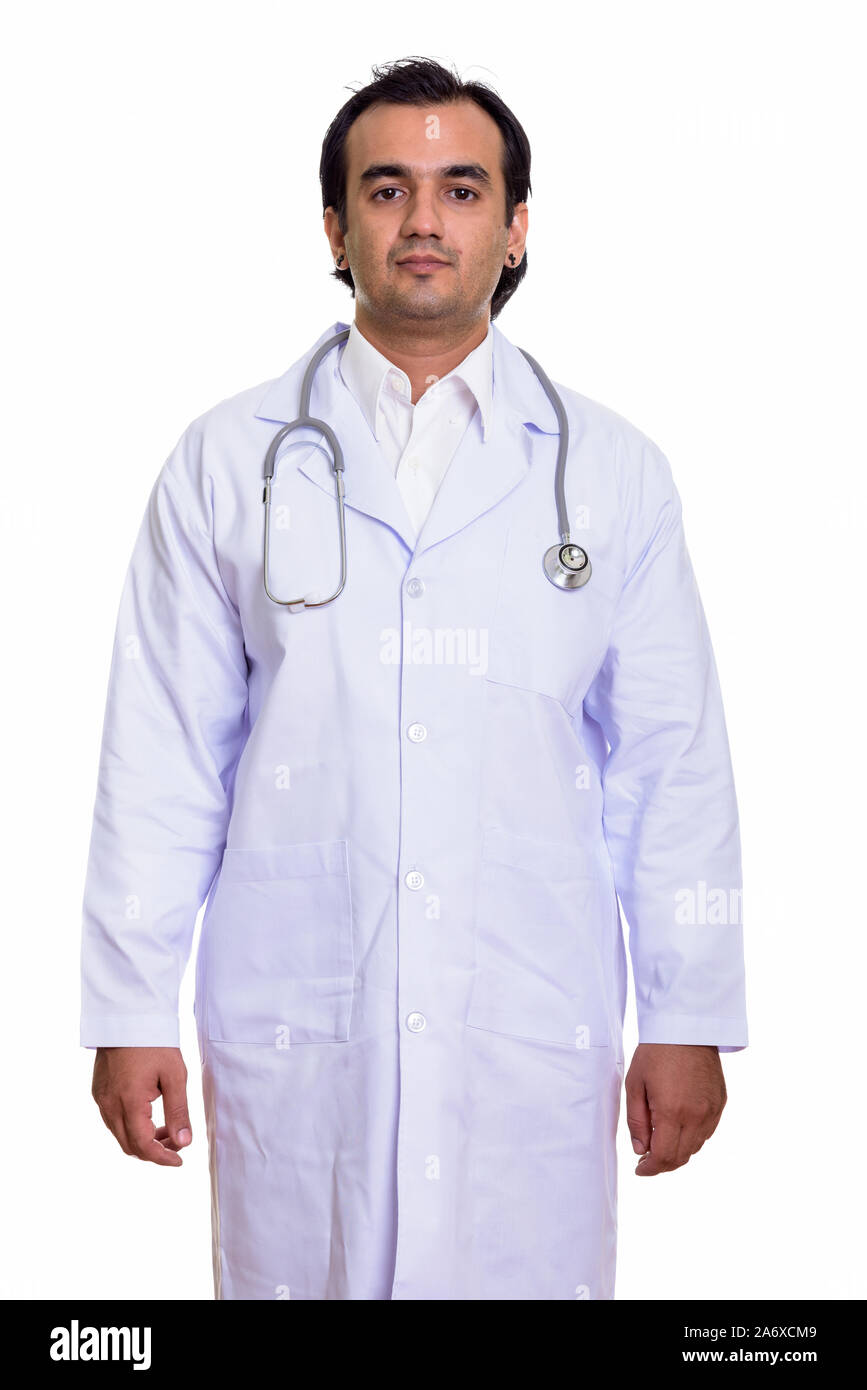 Studio shot of Persian man doctor standing Stock Photo - Alamy