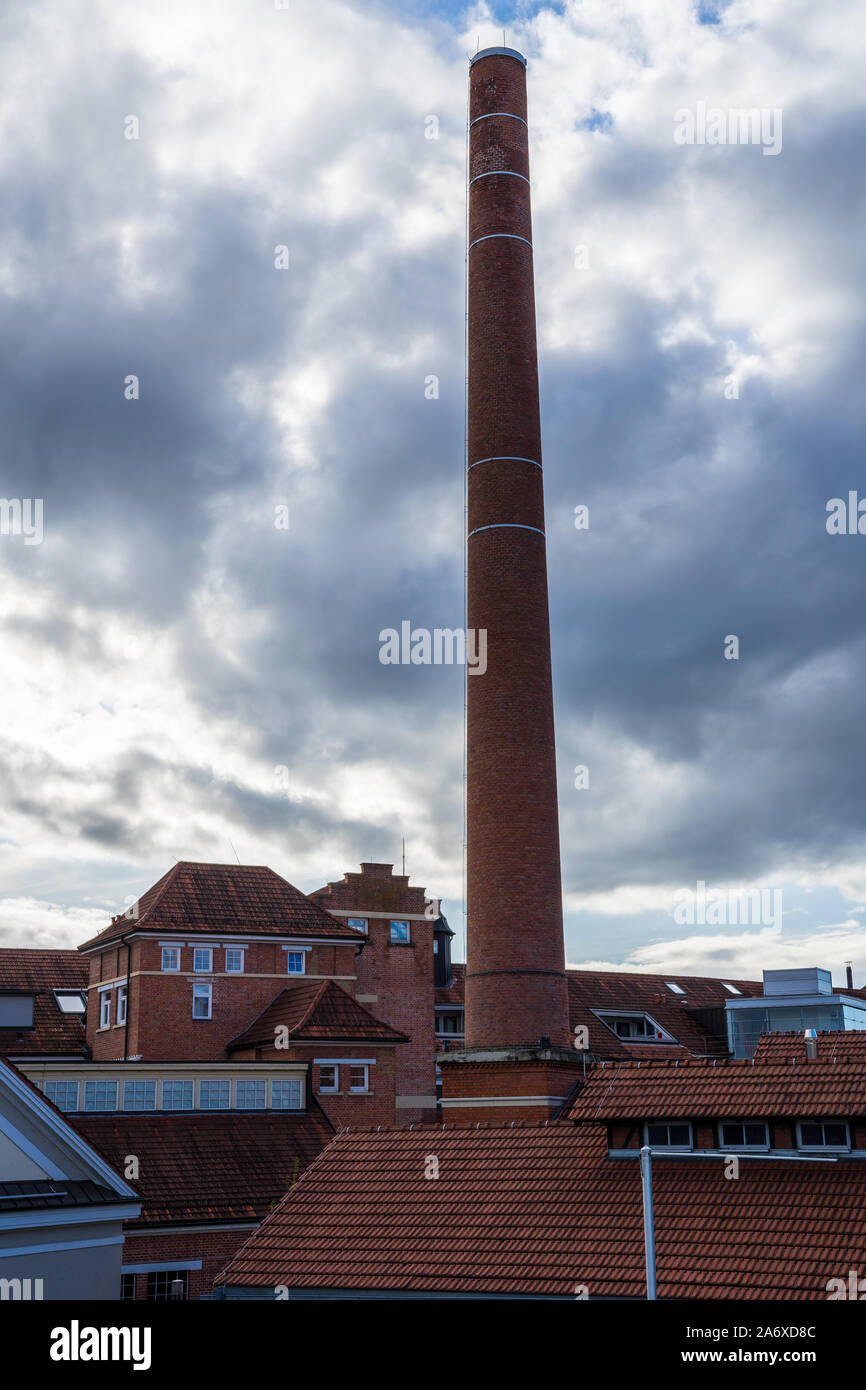 Germany, Historical old red brick buildings and chimney of ancient ...