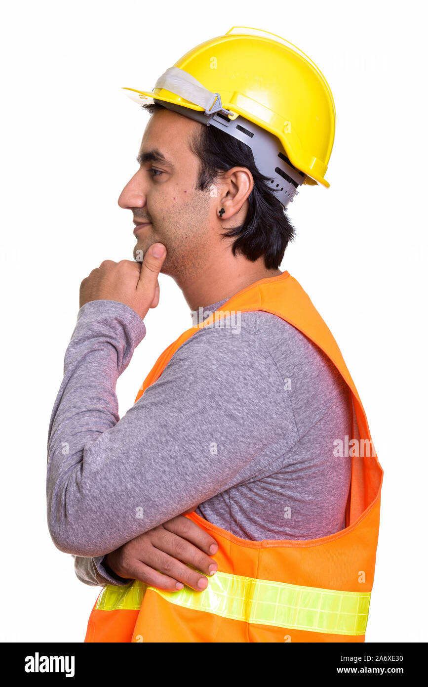 Profile view of happy Persian man construction worker thinking Stock ...