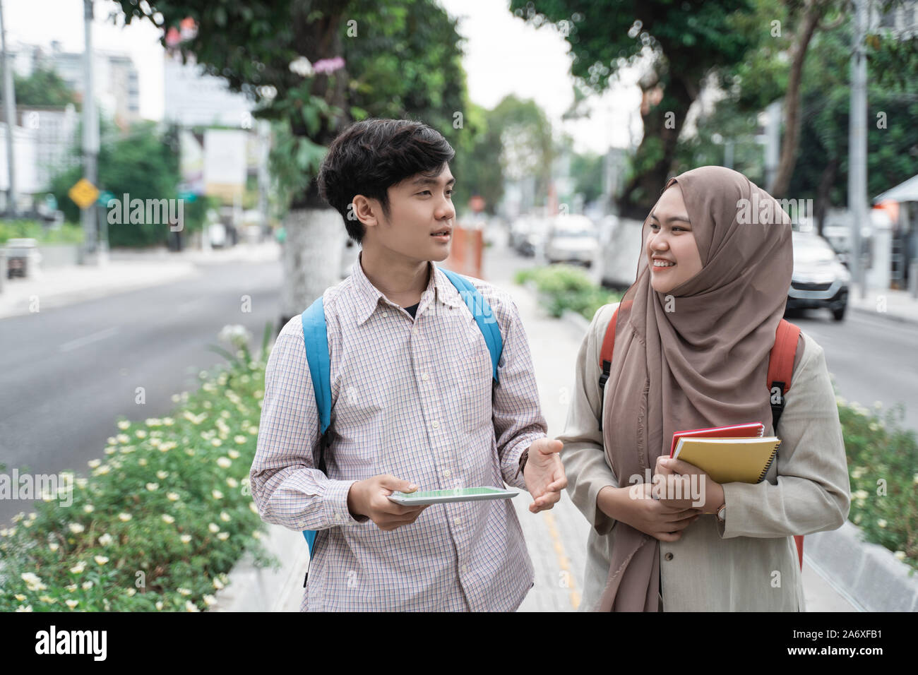 Couple university students chatting campus hi-res stock photography and ...