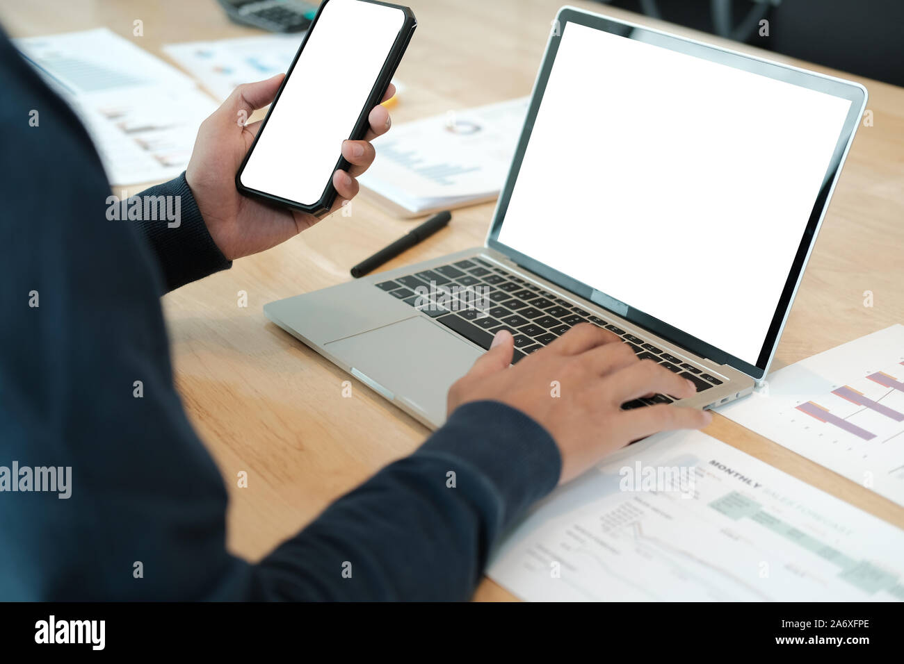 startup man using smart mobile phone. male freelancer working with ...