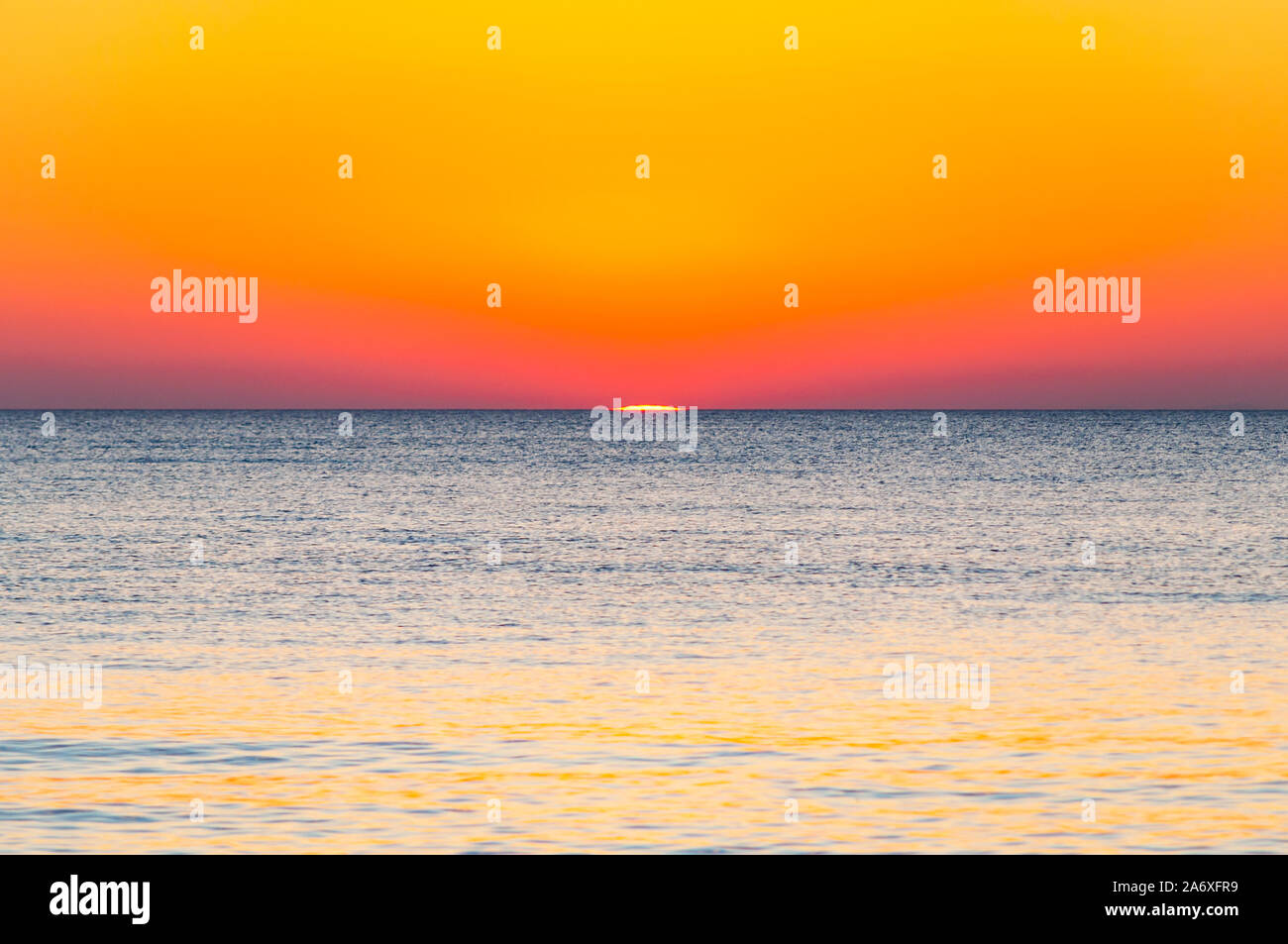 The last seconds of the amazing sundown behind the sea horizon. A bit ...