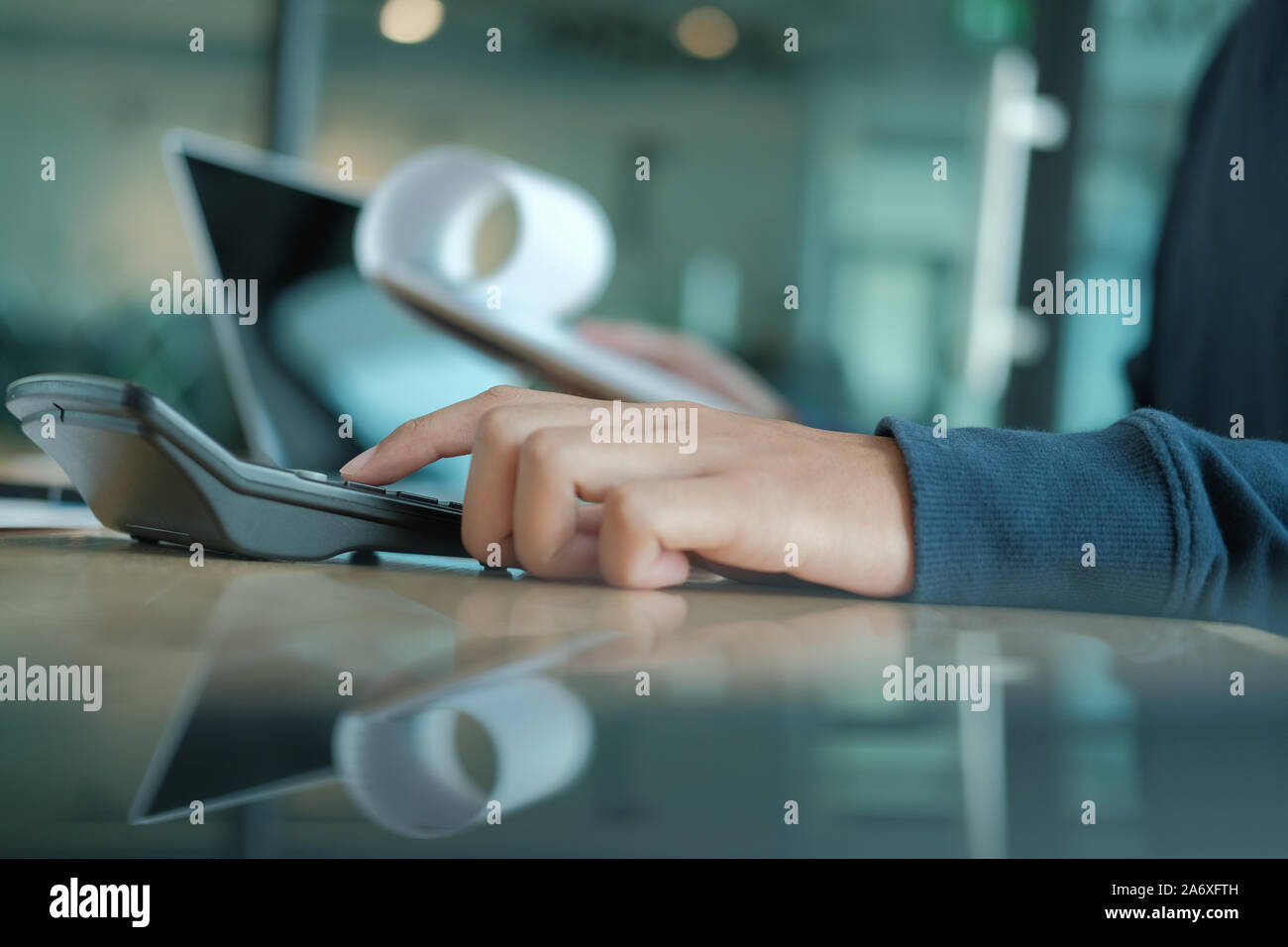 financial adviser working with calculator at office. accountant doing ...