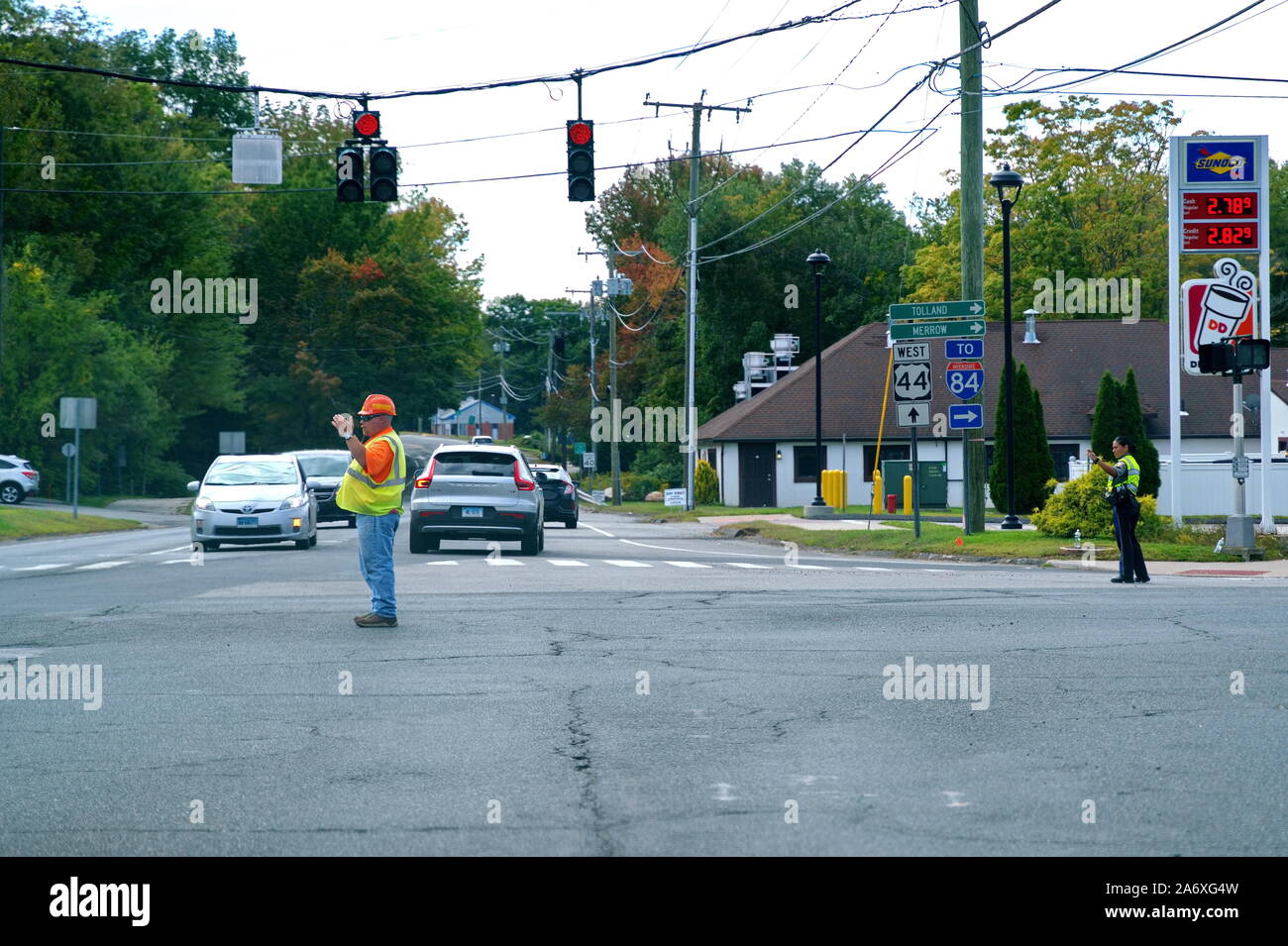 Storrs, CT USA. Sep 16 2019. Construction worker aiding state trooper ...