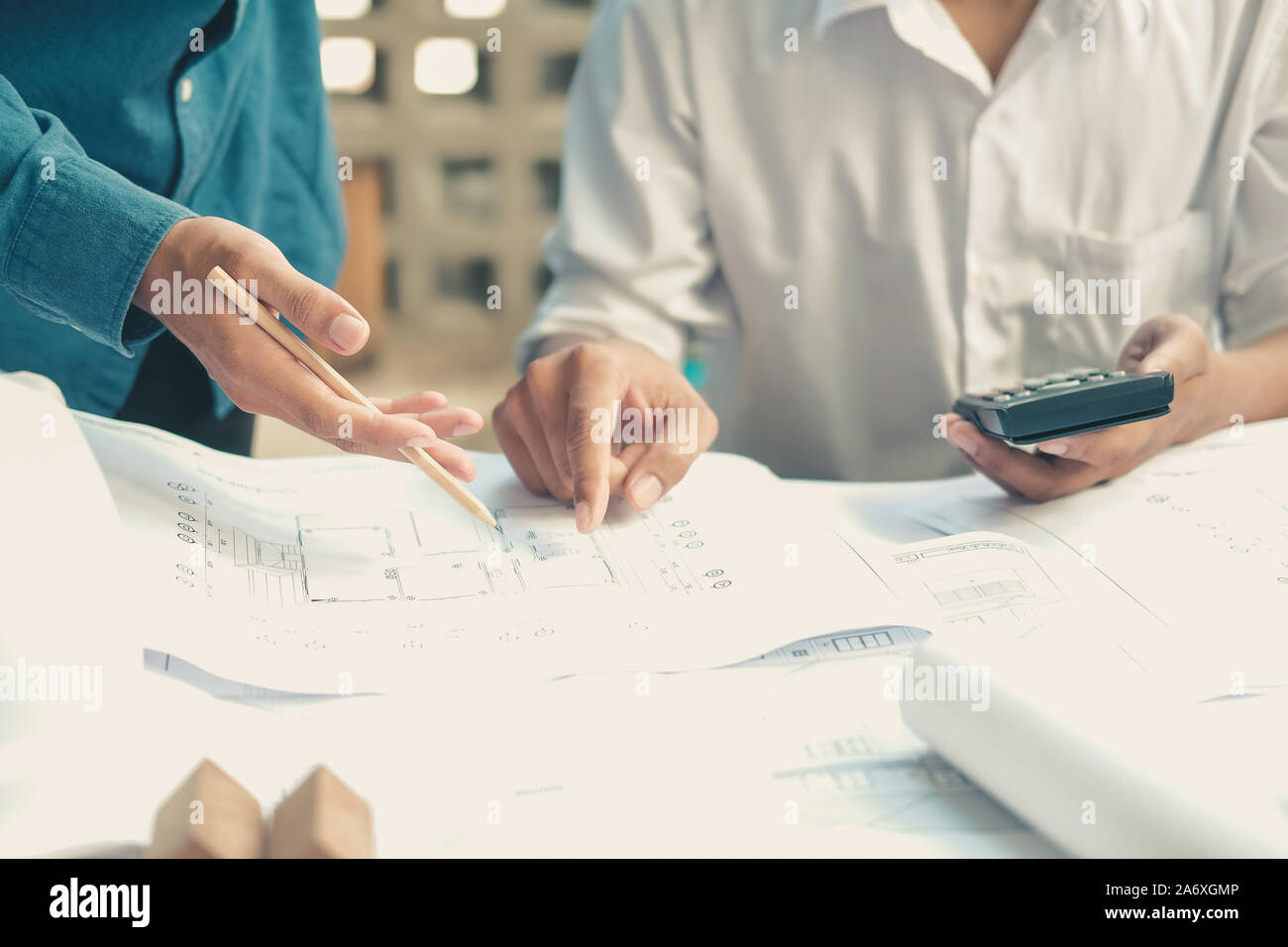 architect engineer working on house blueprint of real estate project at ...