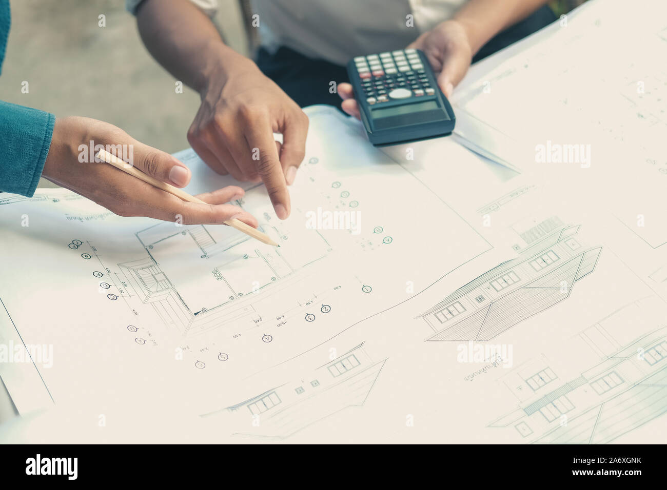 architect engineer working on house blueprint of real estate project at ...