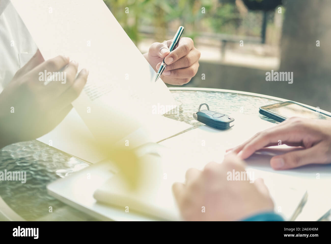 agent showing car insurance to lender. salesman dealer presenting ...