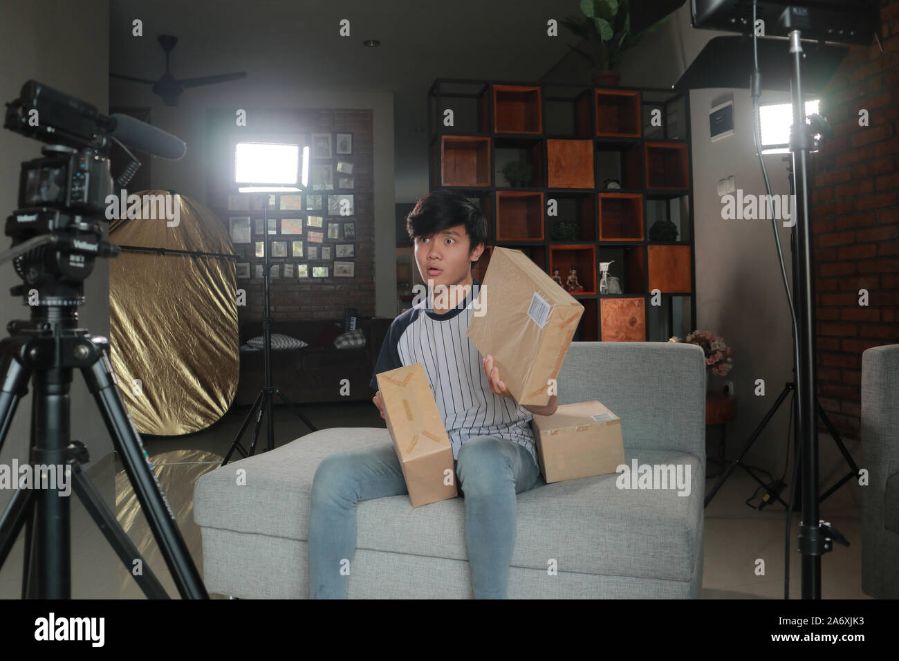 asian young man vlogger recording new vlog about unboxing review Stock ...
