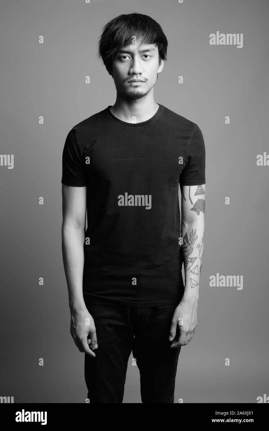 Portrait of young Asian man in black and white Stock Photo - Alamy