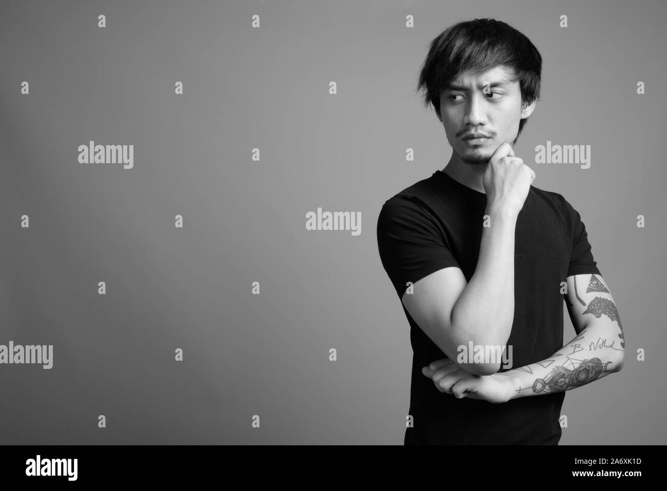 Portrait of young Asian man in black and white Stock Photo - Alamy