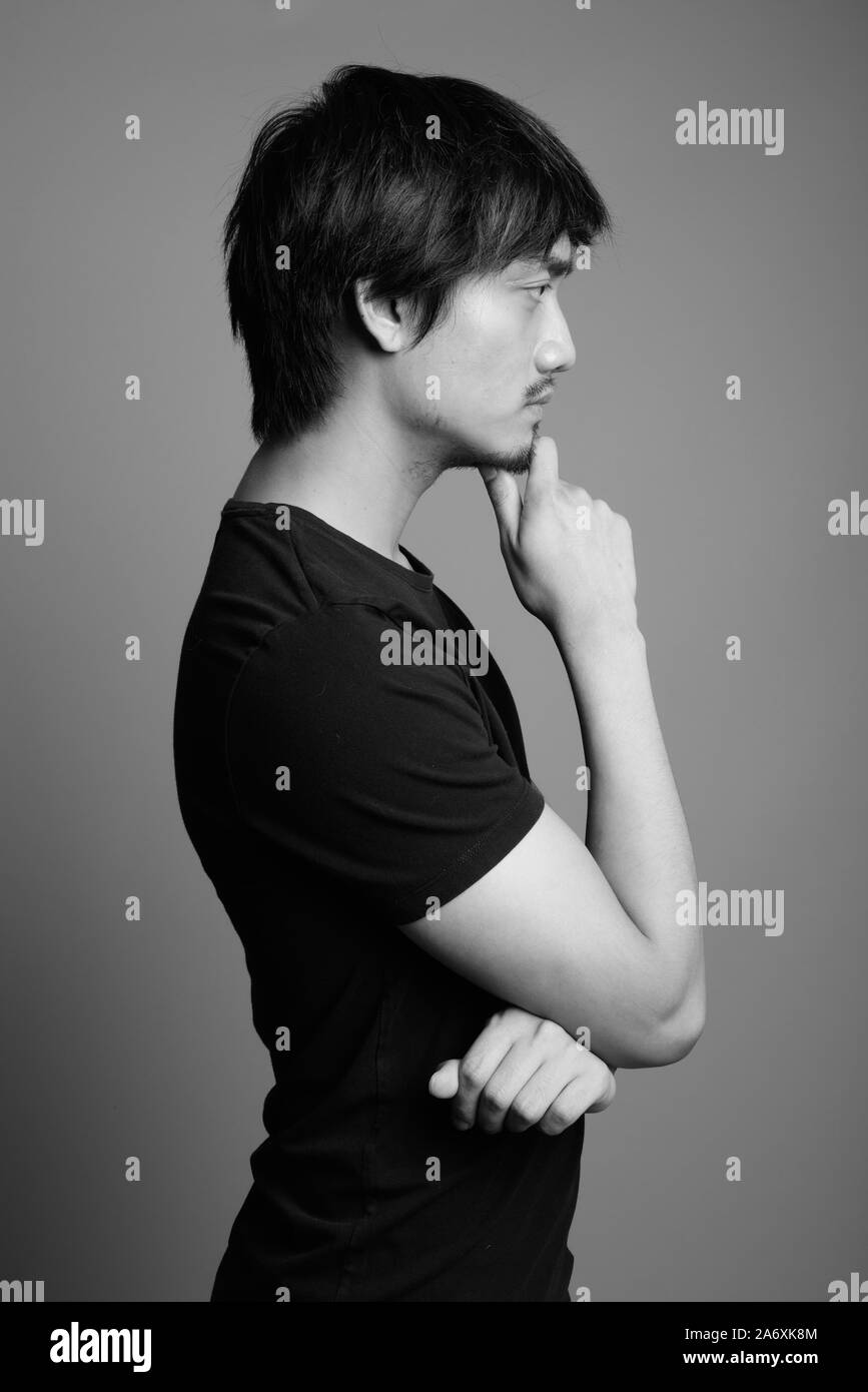 Portrait of young Asian man in black and white Stock Photo - Alamy