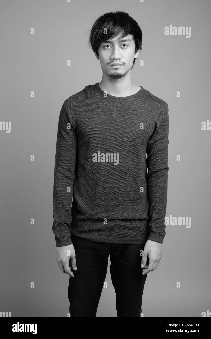 Young man in white long Black and White Stock Photos & Images - Alamy