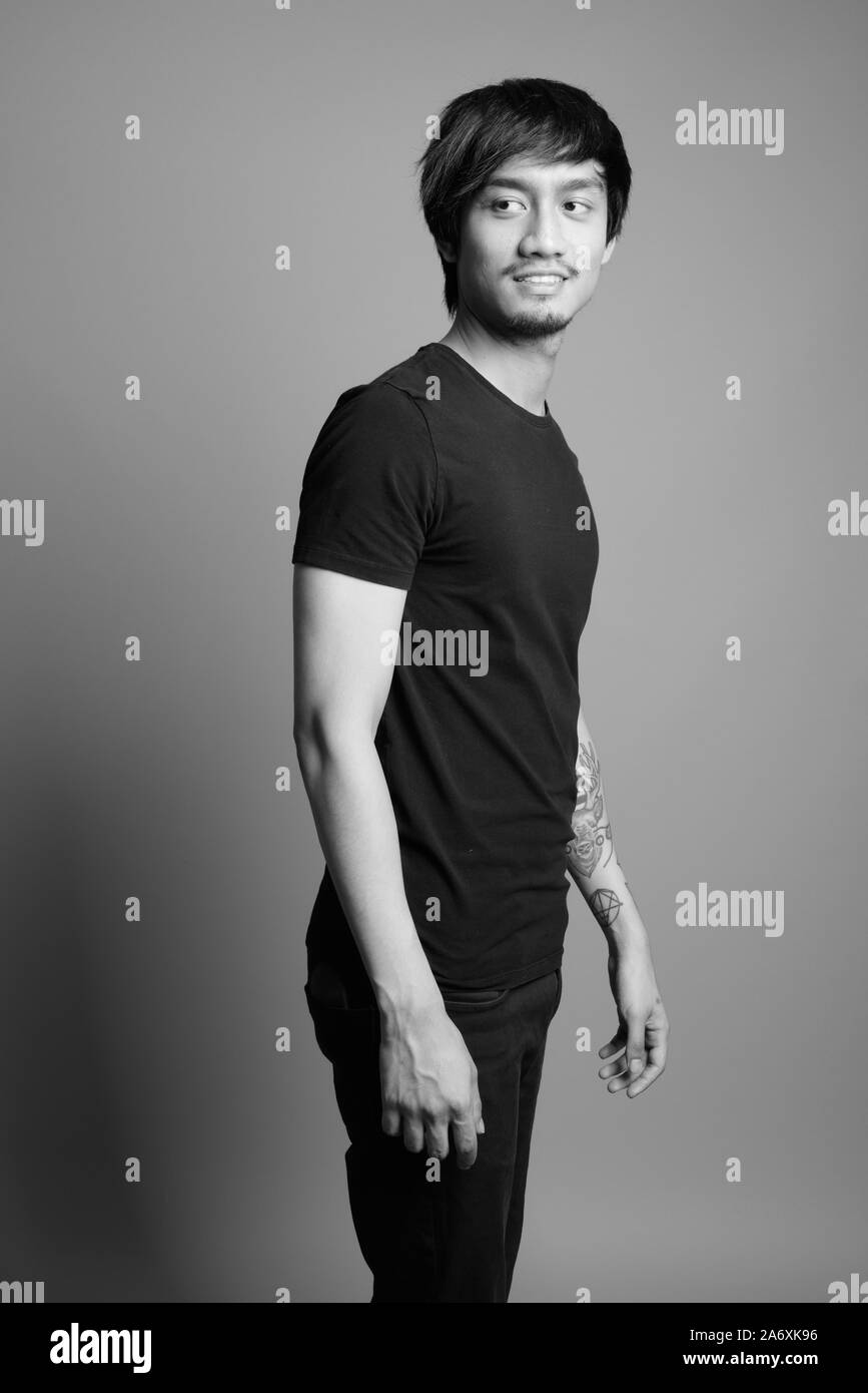 Portrait of young Asian man in black and white Stock Photo - Alamy