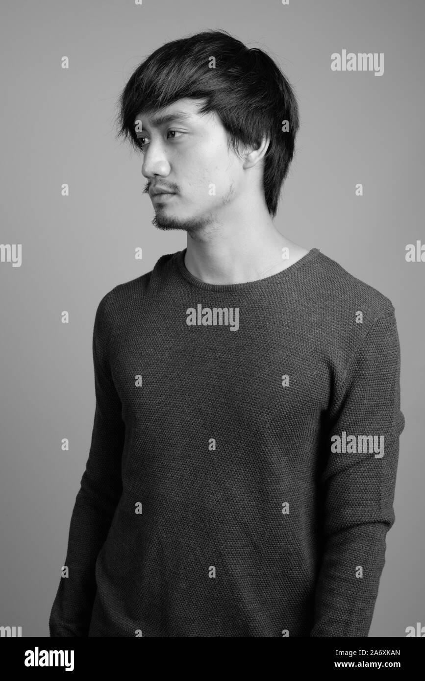 Portrait of young Asian man in black and white Stock Photo - Alamy