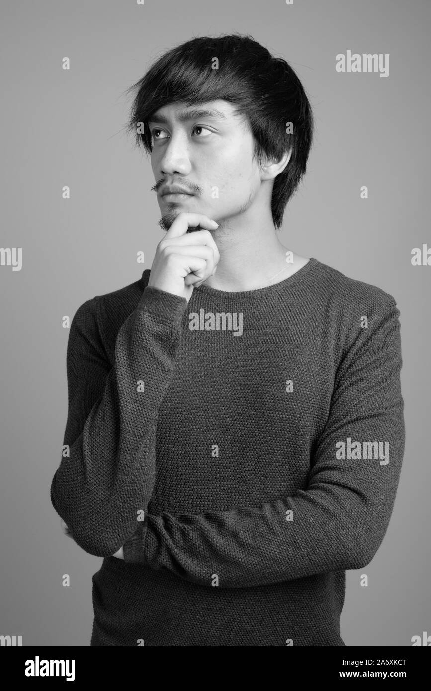 Portrait of young Asian man in black and white Stock Photo - Alamy