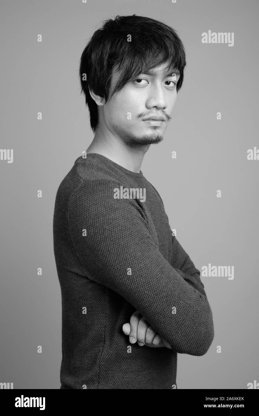 Portrait of young Asian man in black and white Stock Photo - Alamy