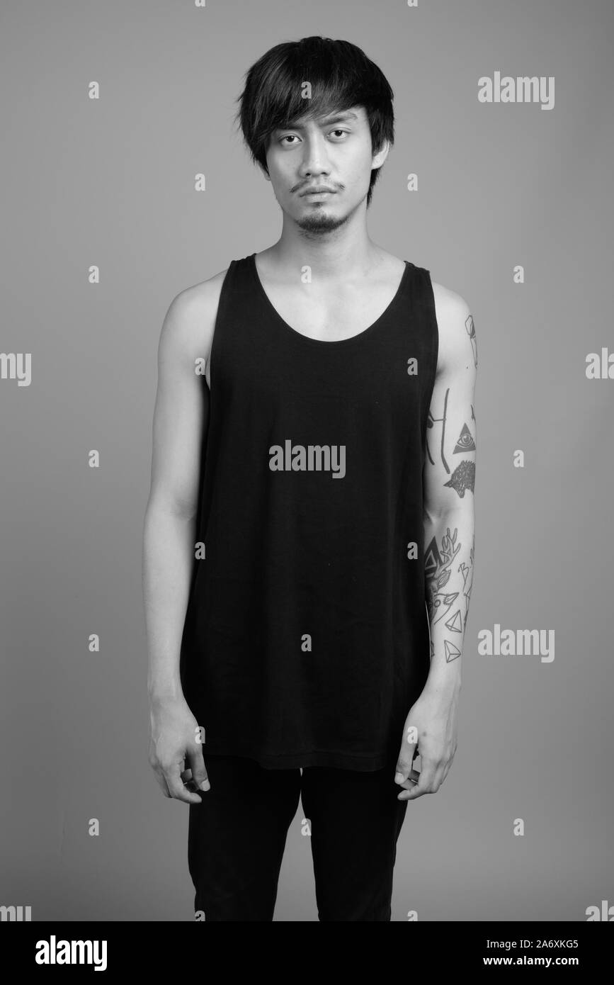 Portrait of young Asian man in black and white Stock Photo - Alamy