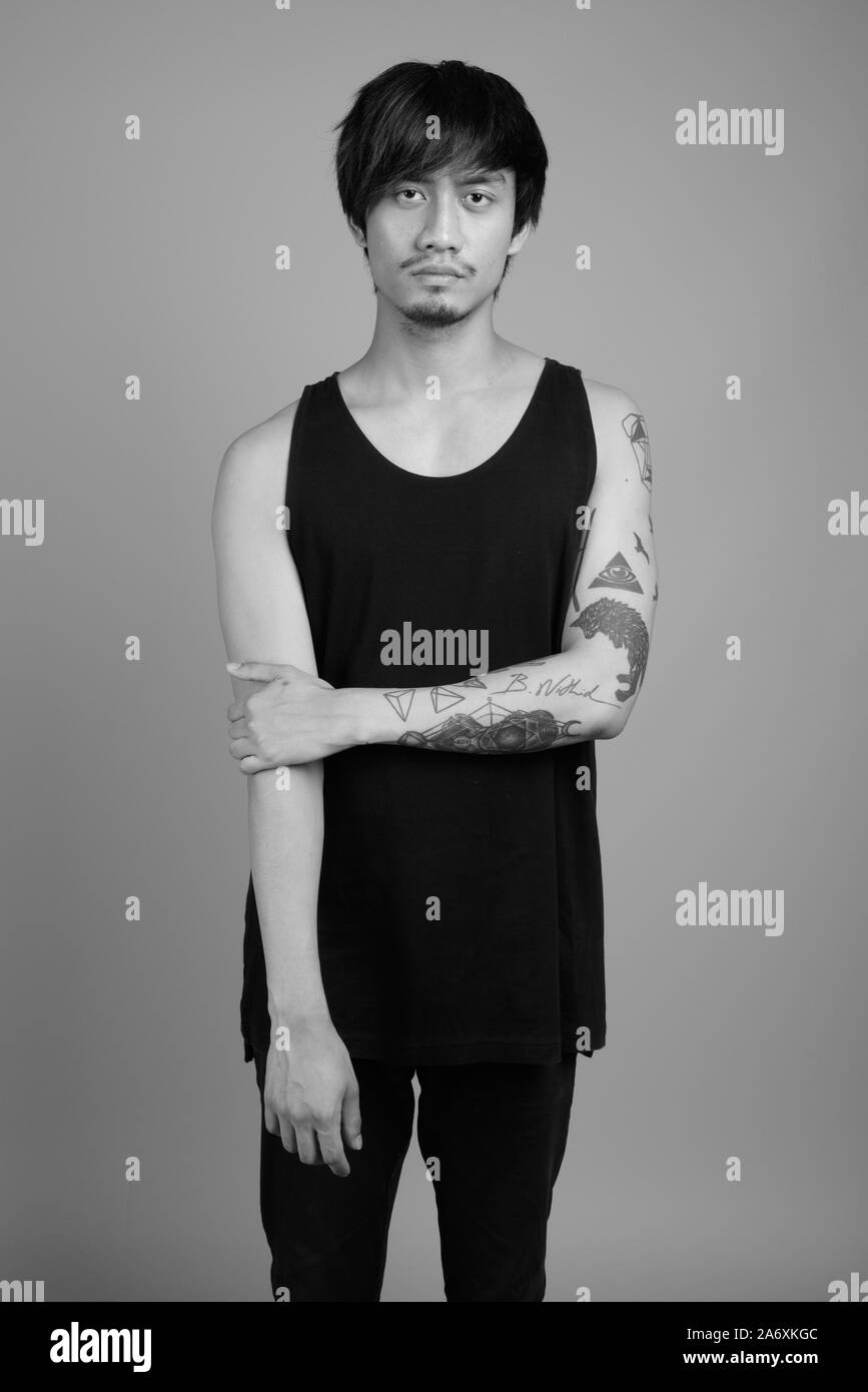 Portrait of young Asian man in black and white Stock Photo - Alamy