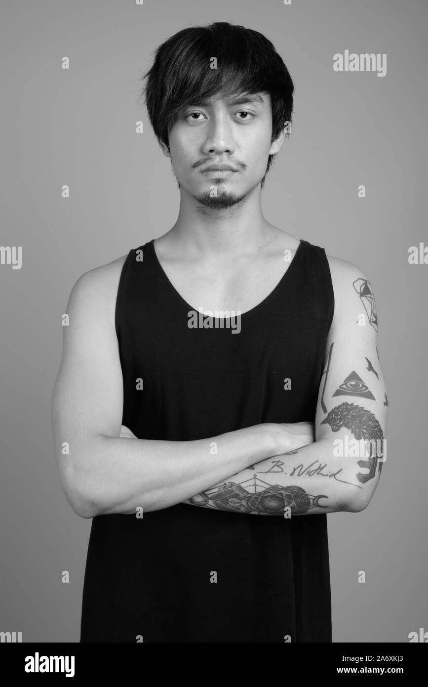 Portrait of young Asian man in black and white Stock Photo - Alamy