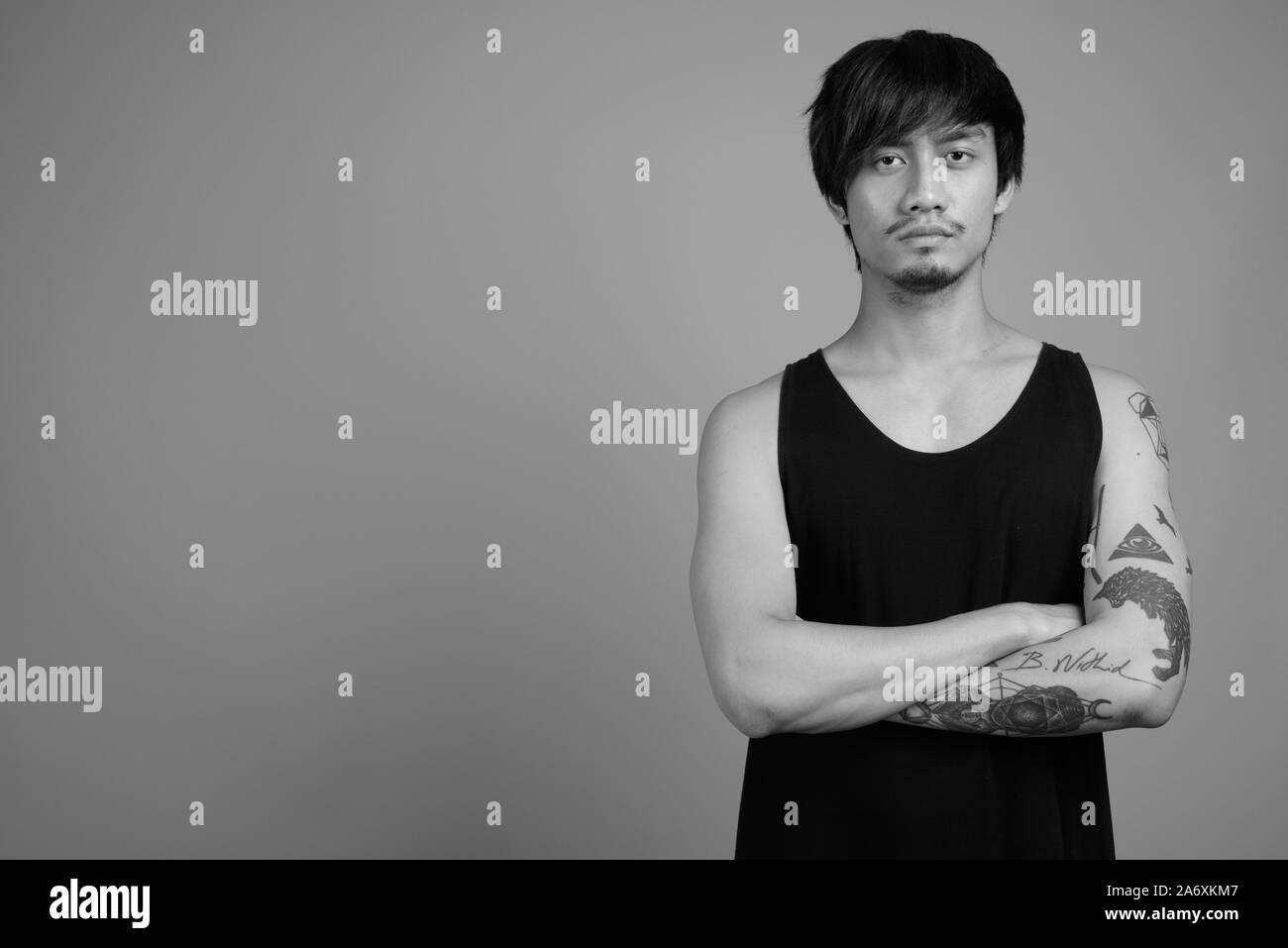 Portrait of young Asian man in black and white Stock Photo - Alamy