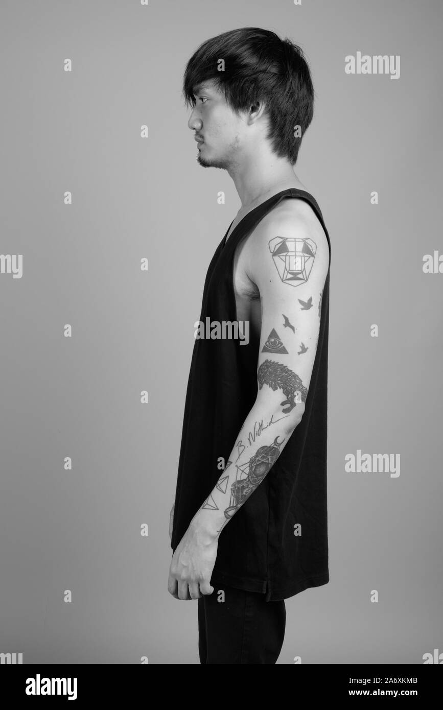 Portrait of young Asian man in black and white Stock Photo - Alamy