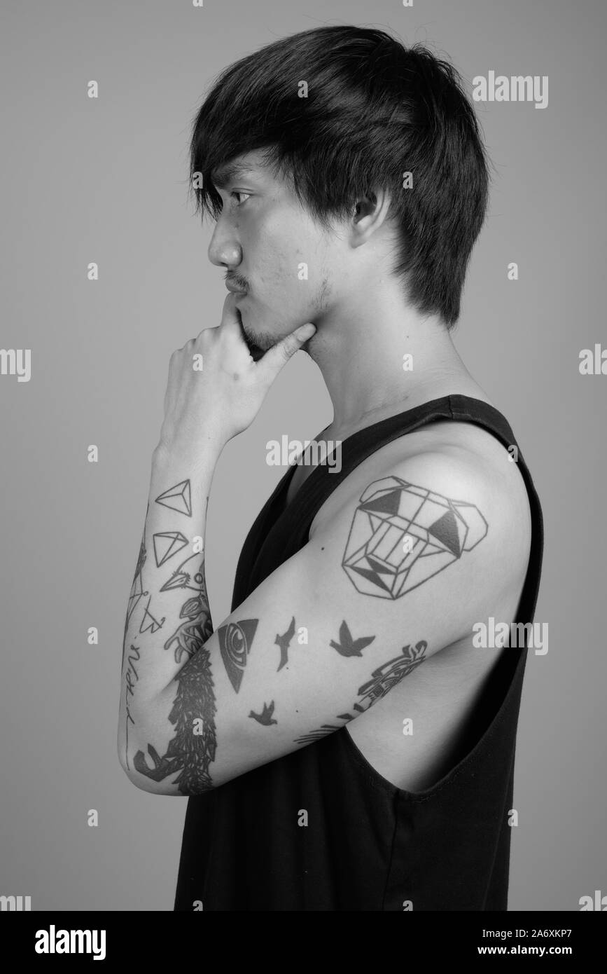 Portrait of young Asian man in black and white Stock Photo - Alamy