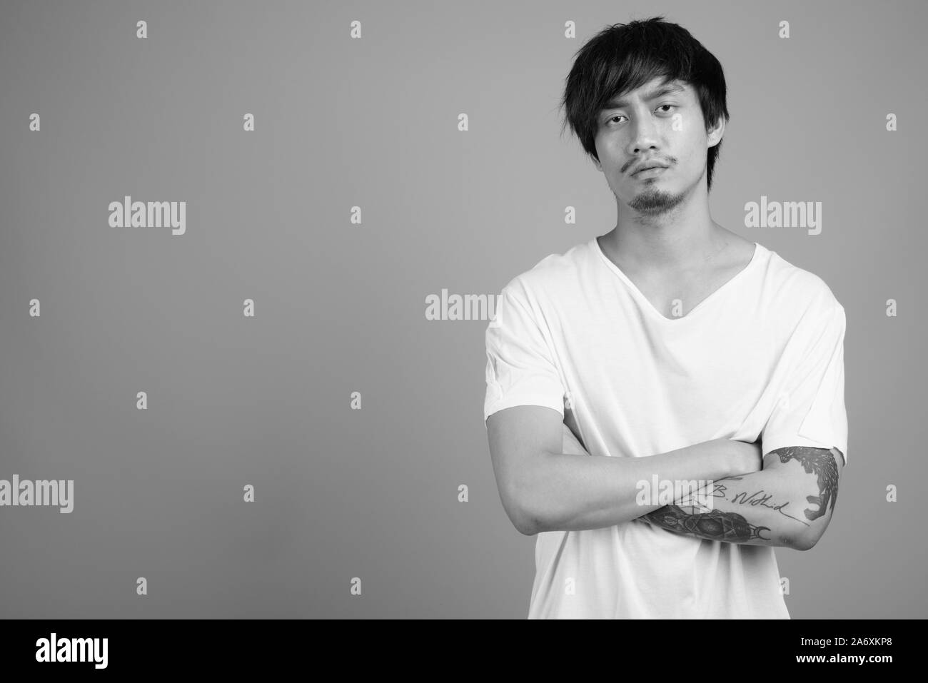 Portrait of young Asian man in black and white Stock Photo - Alamy