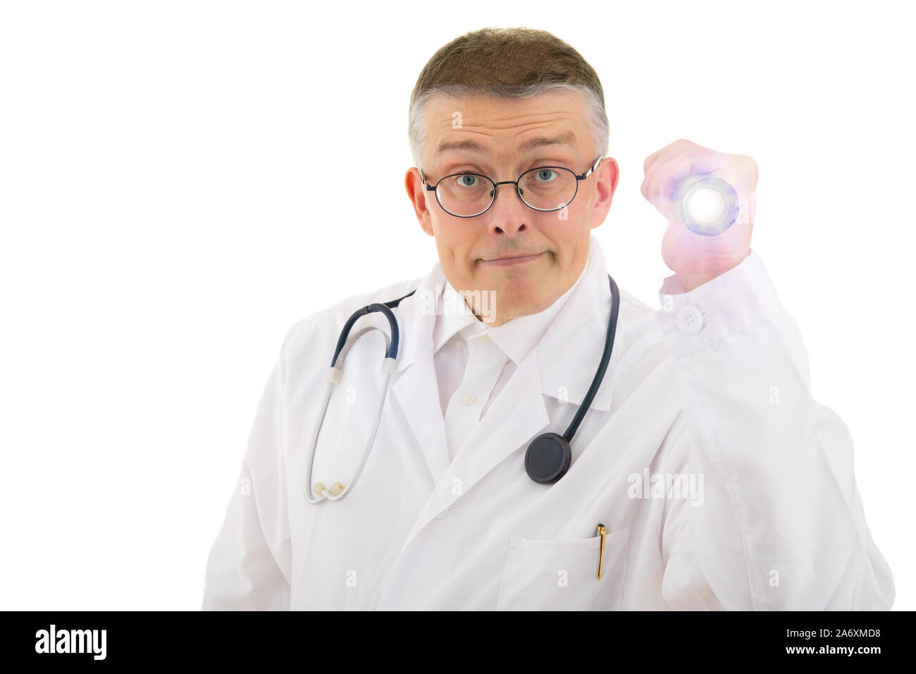 doctor looks closely and shines a flashlight Stock Photo - Alamy
