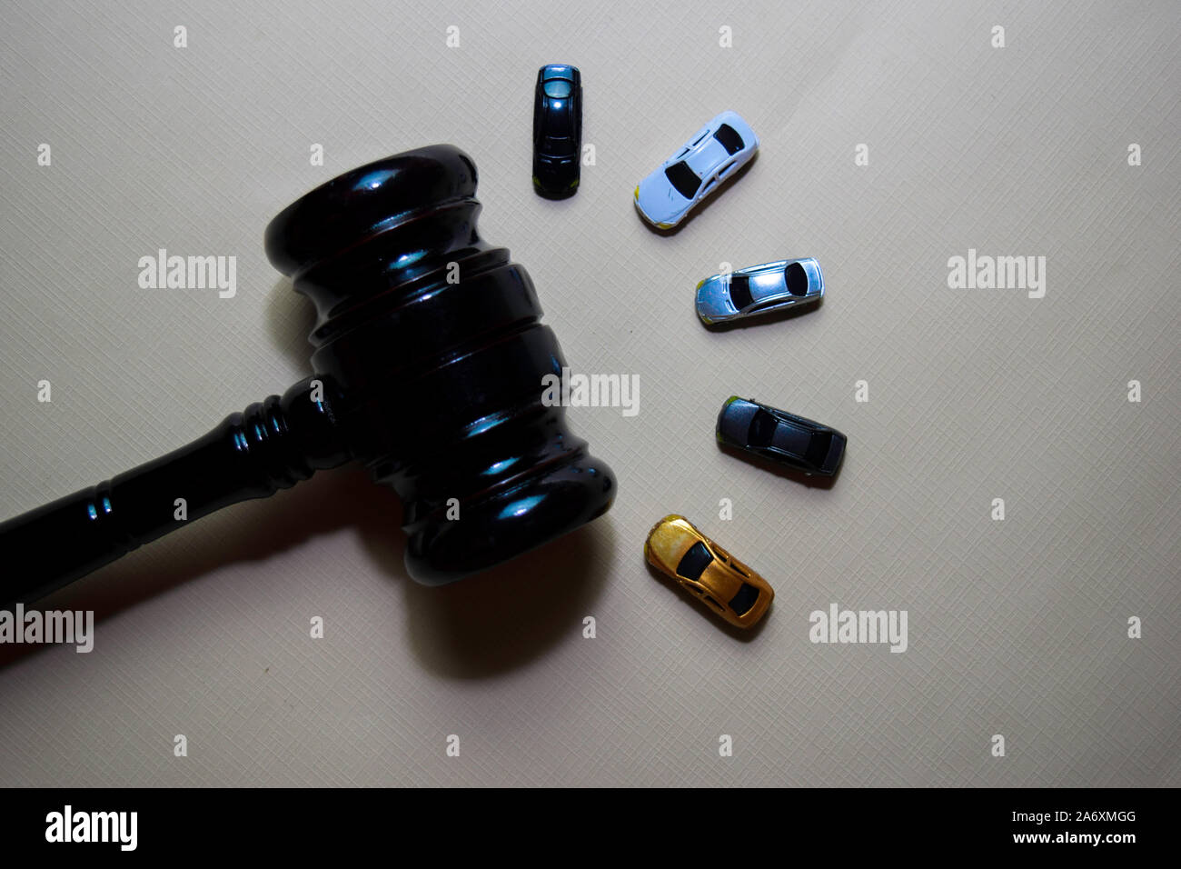 Miniature toy car and Judge gavel on office desk. Justice law concept ...