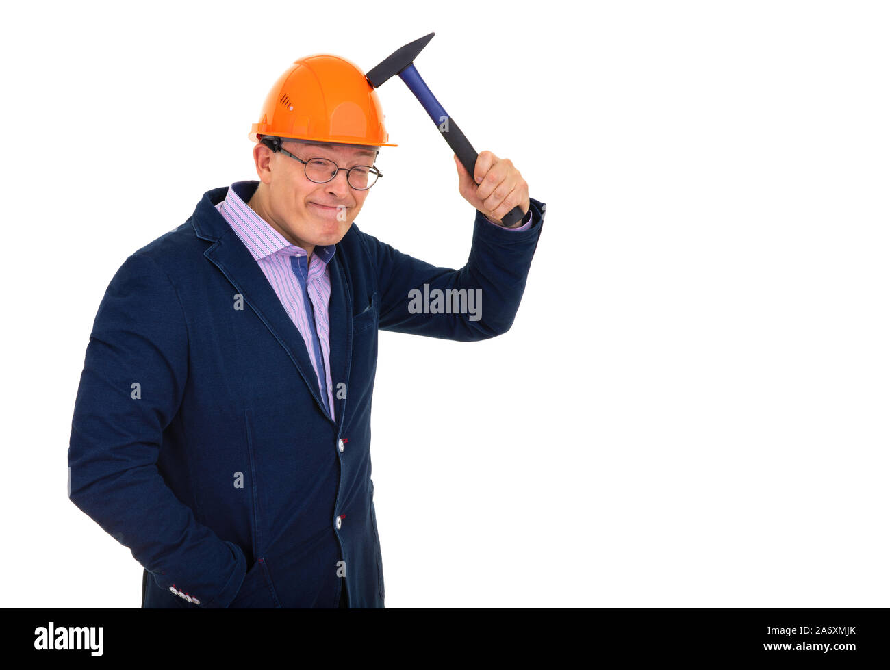 man checks the orange helmet for strength Stock Photo - Alamy