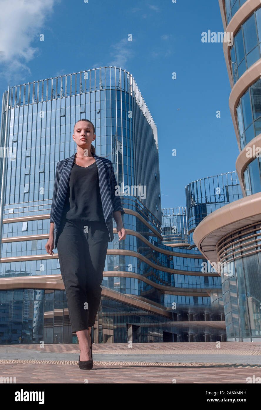 Business woman coming out of building hi-res stock photography and ...