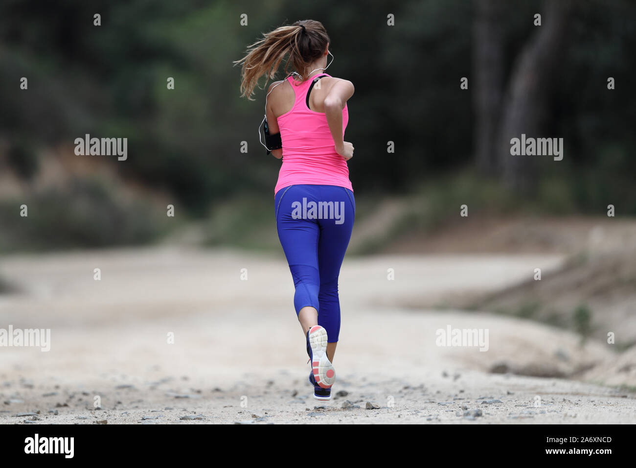 Back view full body portrait of a runner woman running outdoors Stock ...