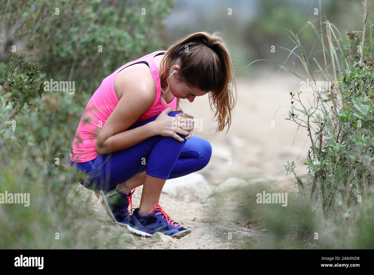 Stressed runner complaining suffering knee ache training outdoors Stock ...
