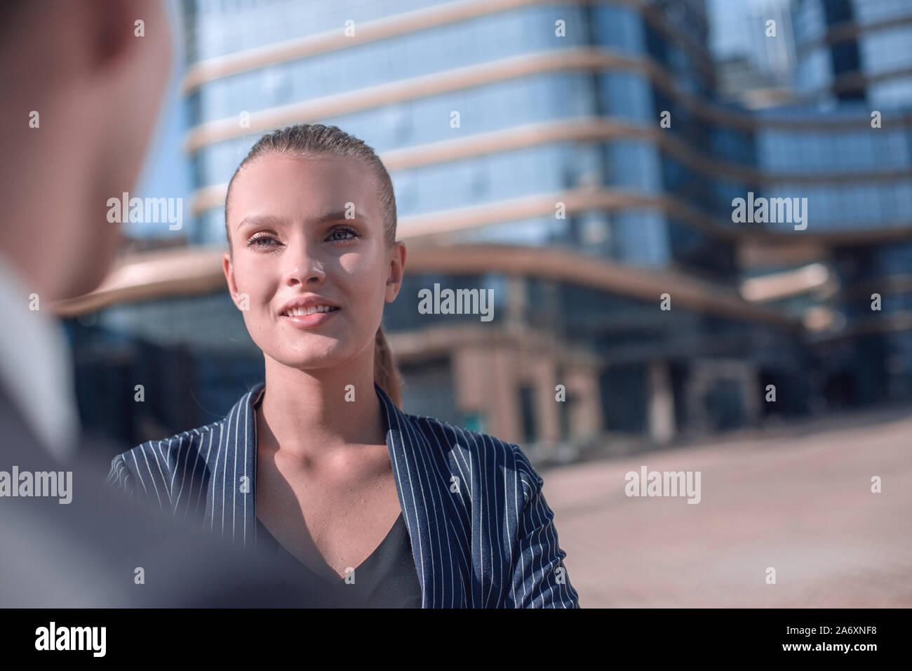 young people talking standing in front of the office Stock Photo - Alamy
