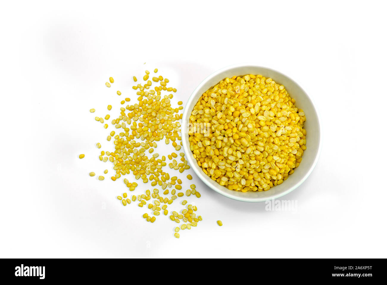 Top view of Hulled split mung bean in White cup on white background ...